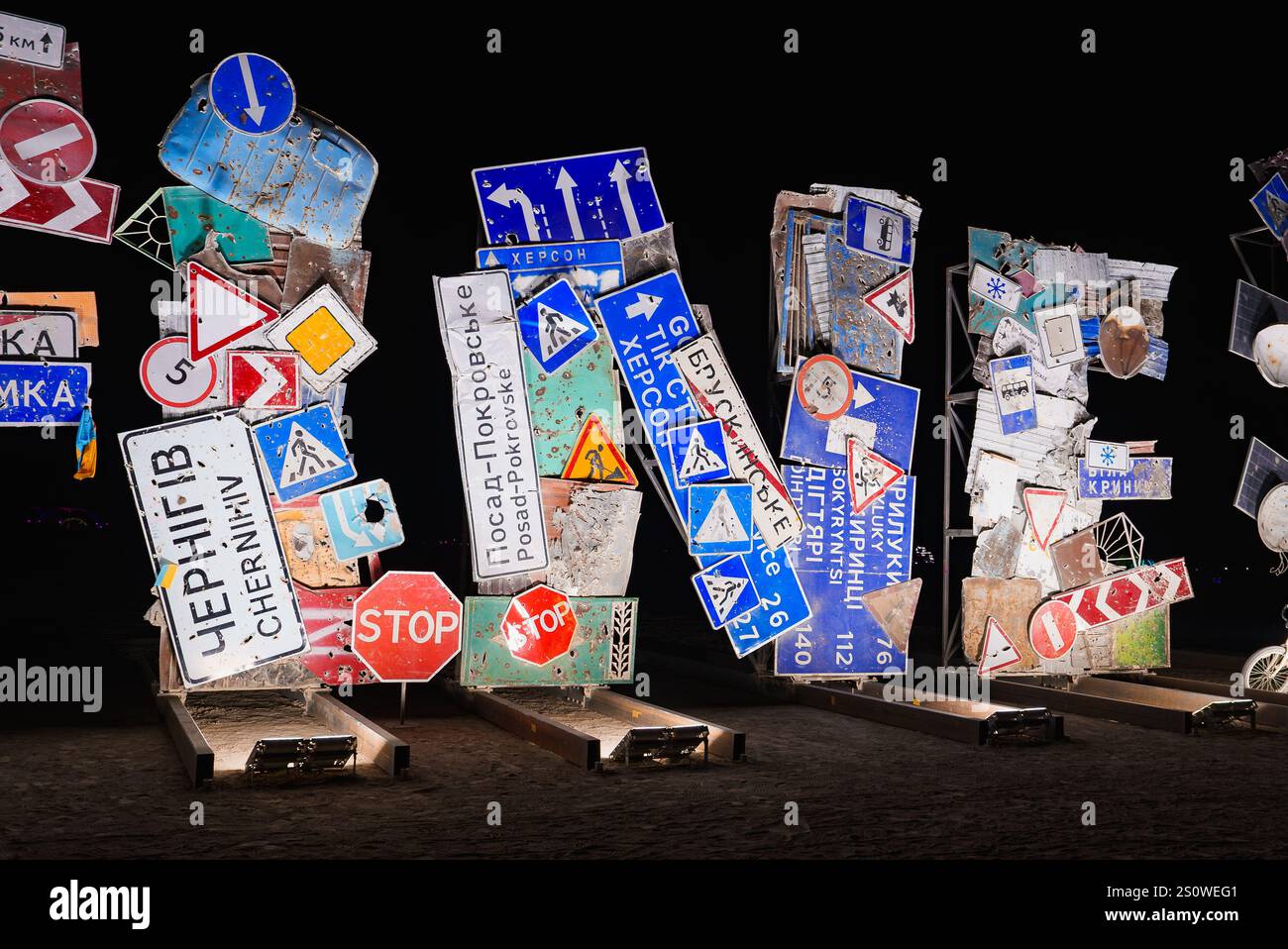 Cyrillic Road Sign Art Installation Illuminated in Desert Night Stock ...