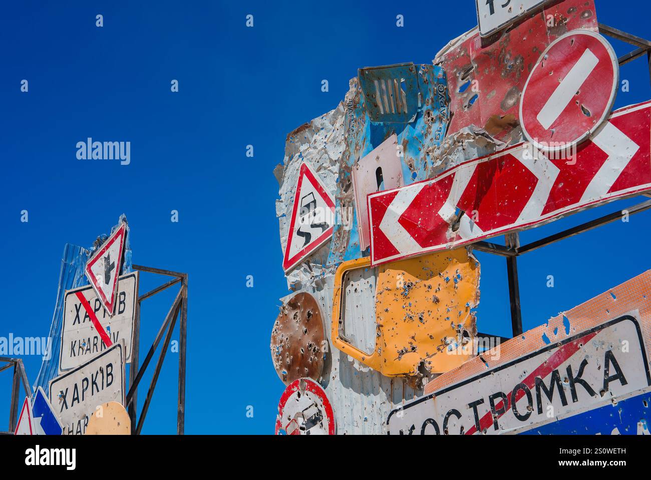 Art Installation of Road Signs with Bullet Holes in Desert Setting ...