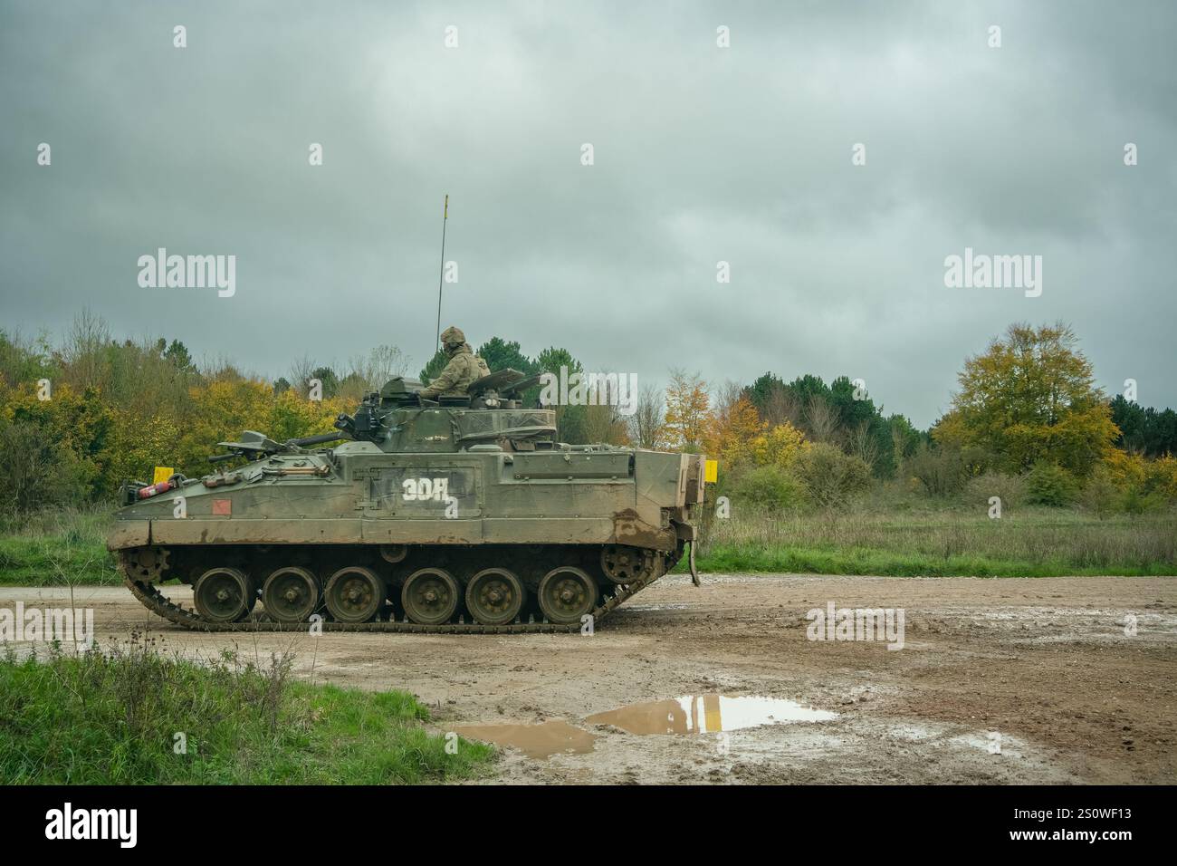 commander and gunner directing a British army Warrior FV510 IFV in ...