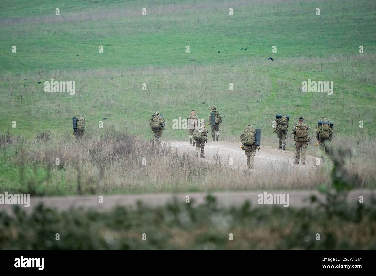 a unit of British army soldiers on a 40kg loaded march tab military ...