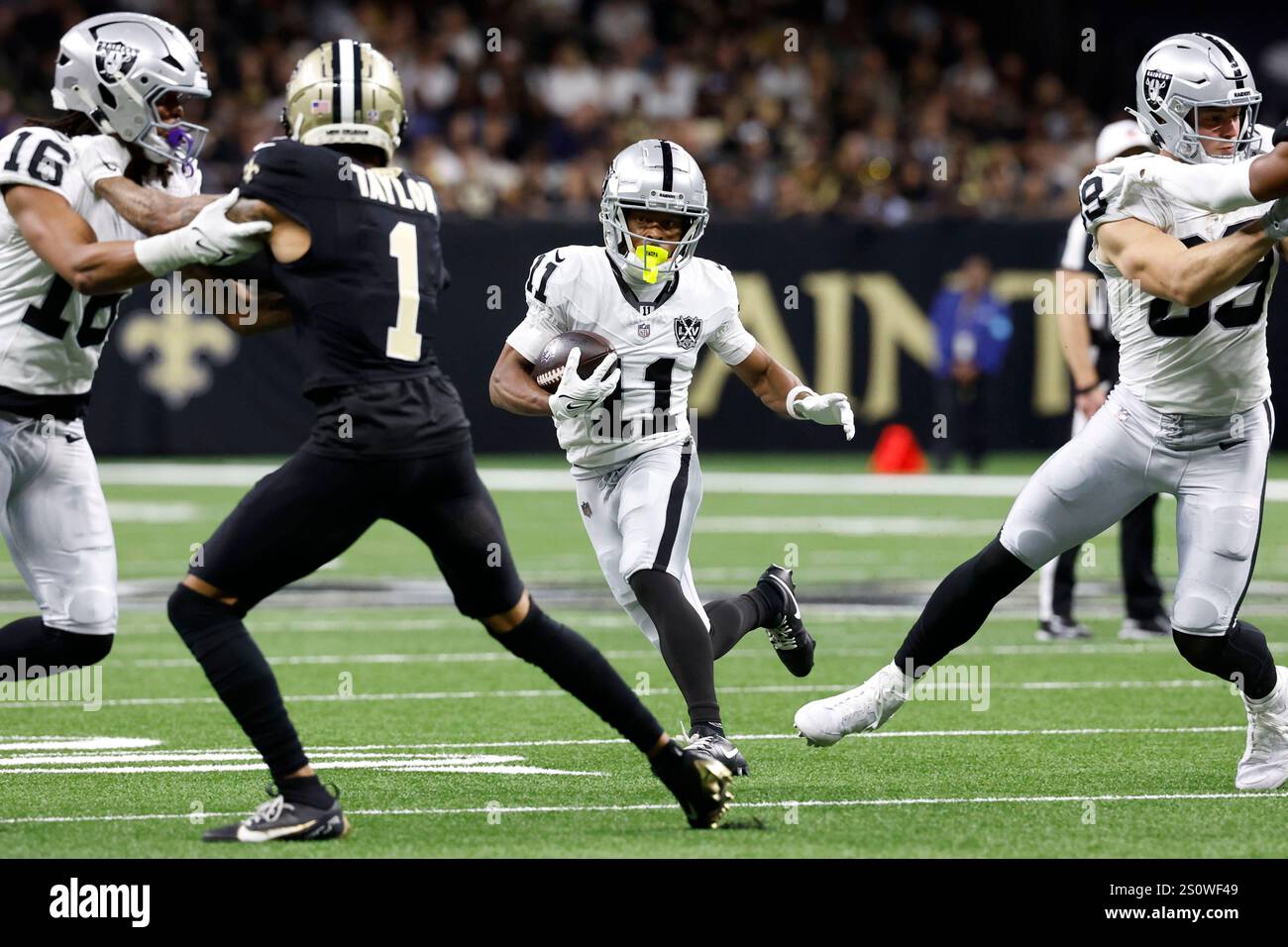 Las Vegas Raiders wide receiver Tre Tucker (11) runs up field during ...