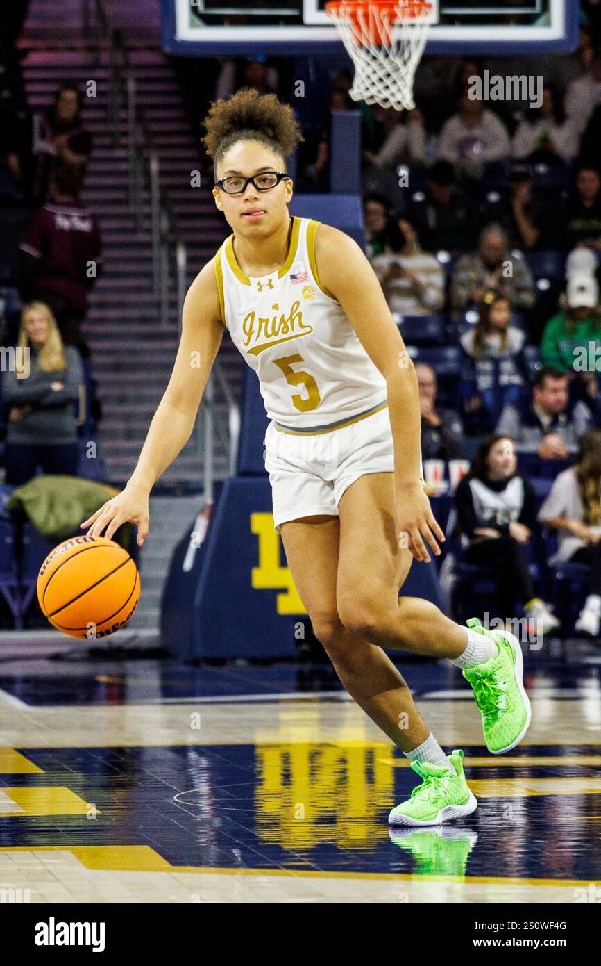South Bend, Indiana, USA. 29th Dec, 2024. Notre Dame guard Olivia Miles (5) directs the offense ...