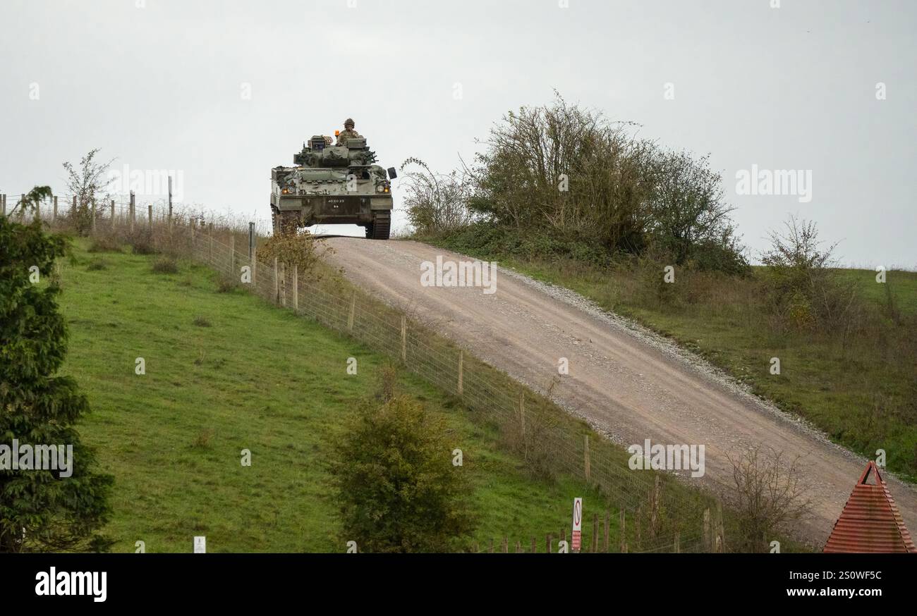 commander and gunner directing a British army Warrior FV510 IFV in ...