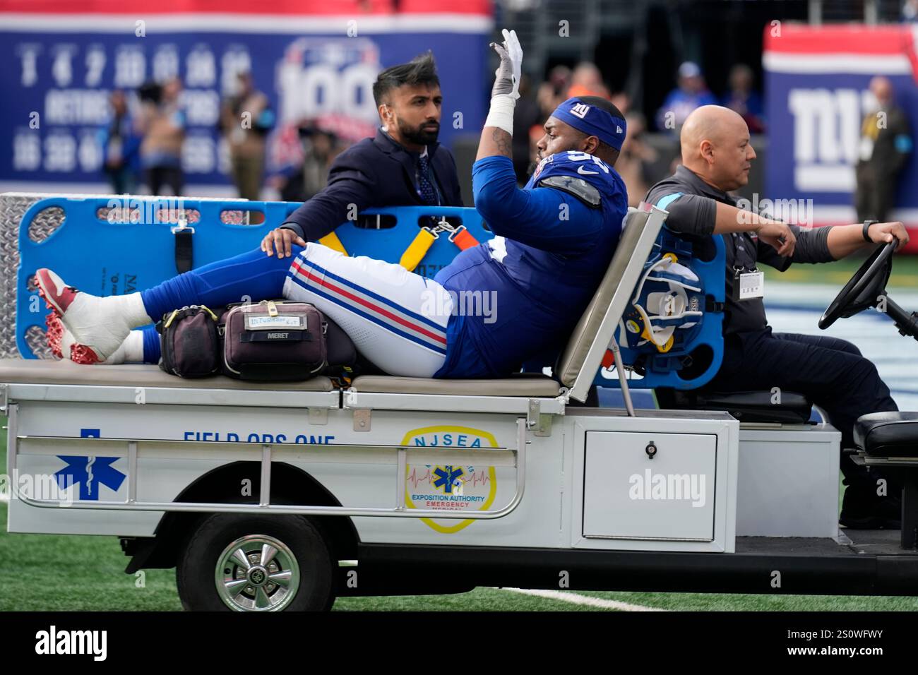 New York Giants defensive tackle Armon Watts (96) is taken off the ...