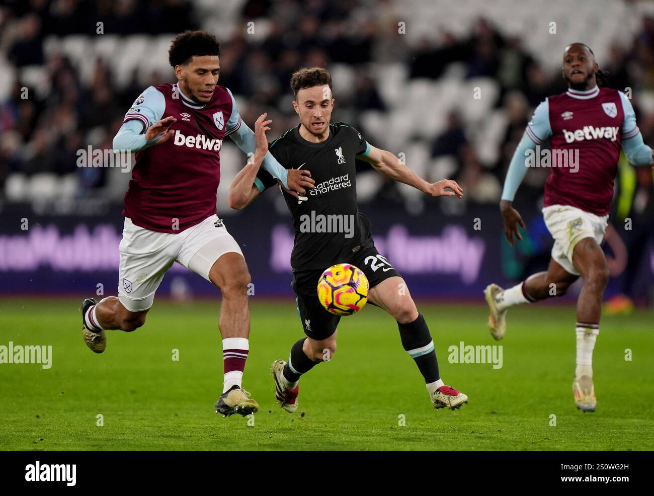 West Ham United's Jean-Clair Todibo (left) and Liverpool's Diogo Jota ...