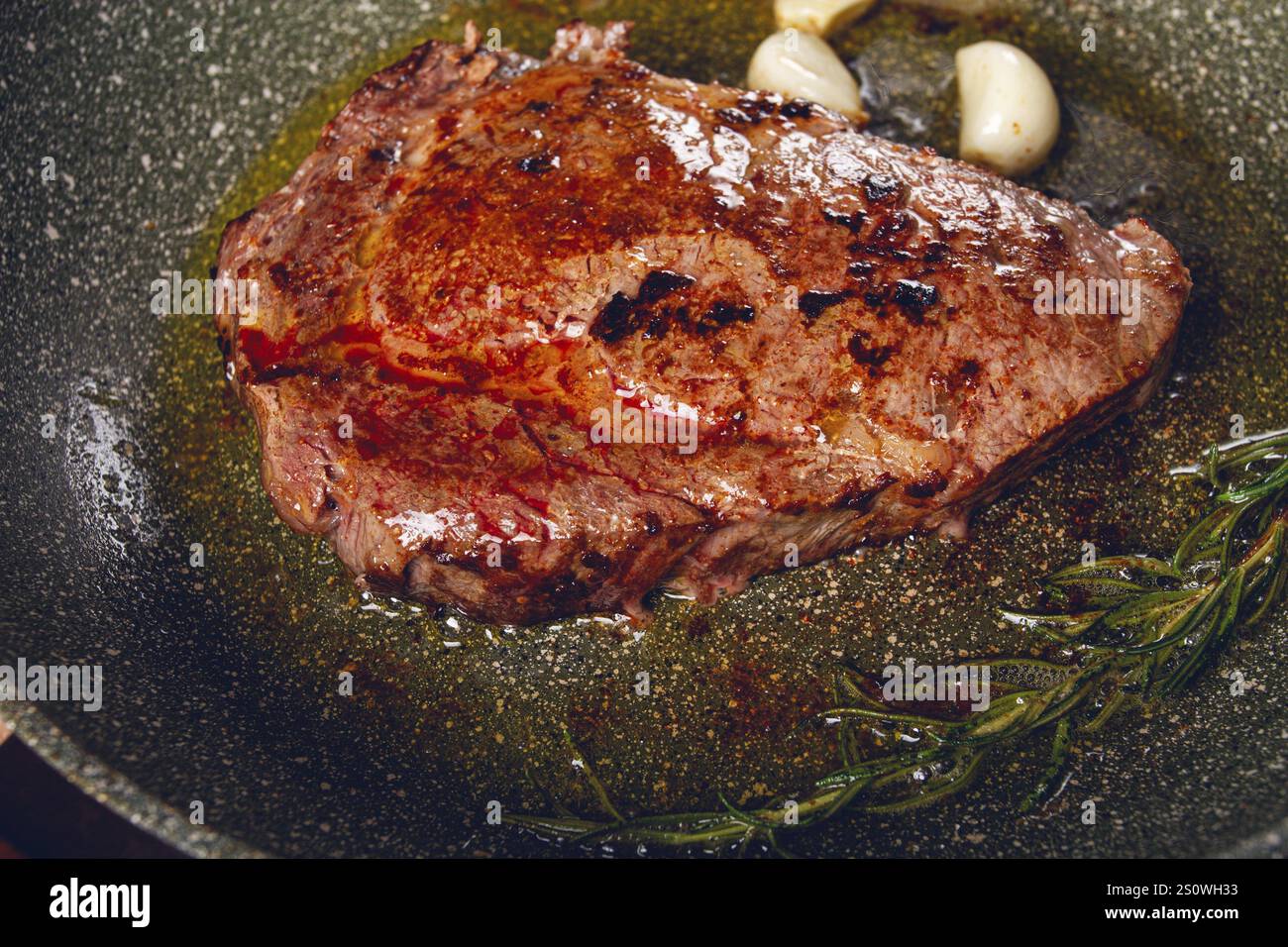 Fried steak, beef steak, rib eye steak, in a frying pan, top view, no ...