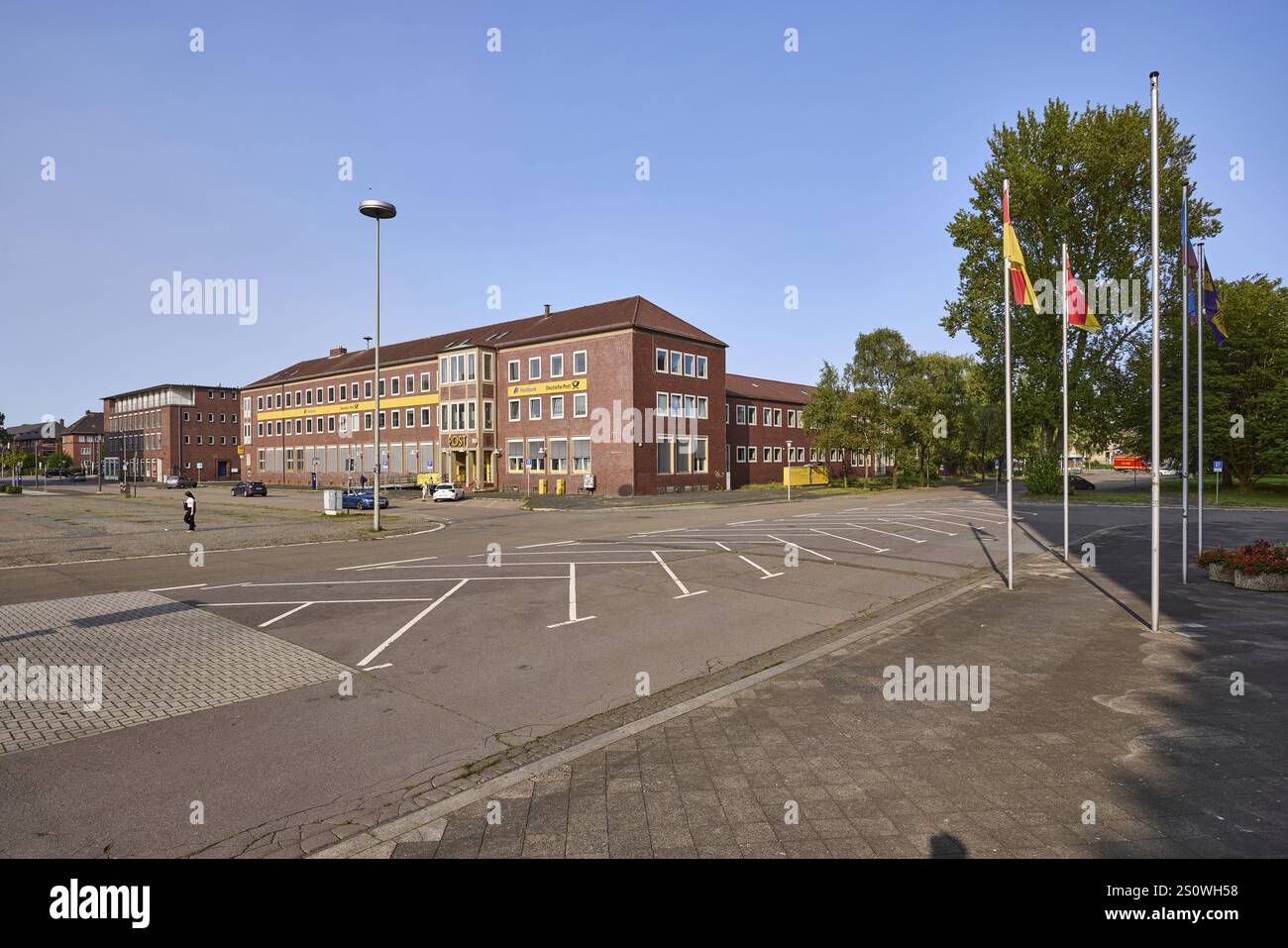 Former post office, lantern, flagpoles, car park with parking boxes ...
