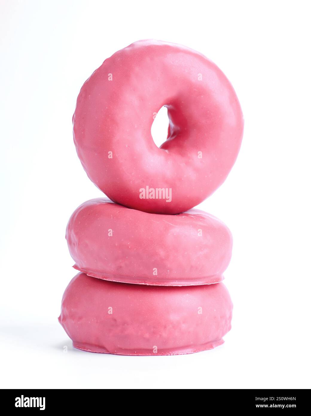 Stacked Pink Glazed Donuts Stock Photo - Alamy