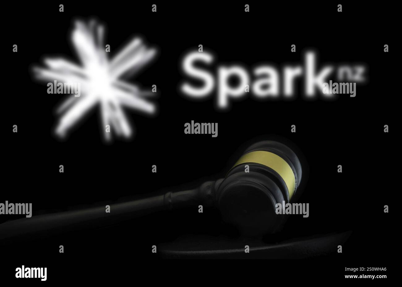 Court gavel in front of the Spark nz logo. Spark New Zealand Limited is ...