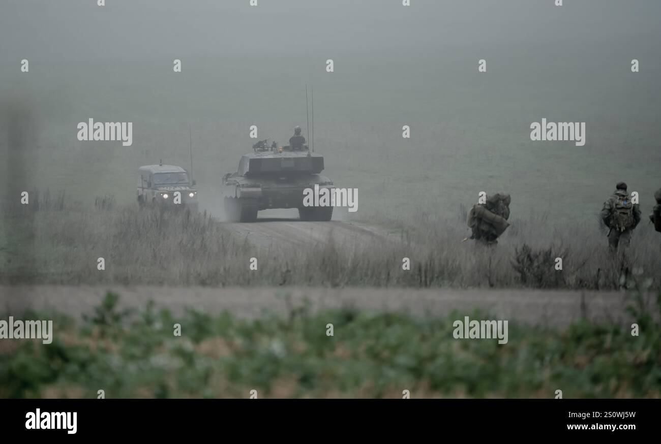 a unit of British army soldiers on a 40kg tab military exercise through ...