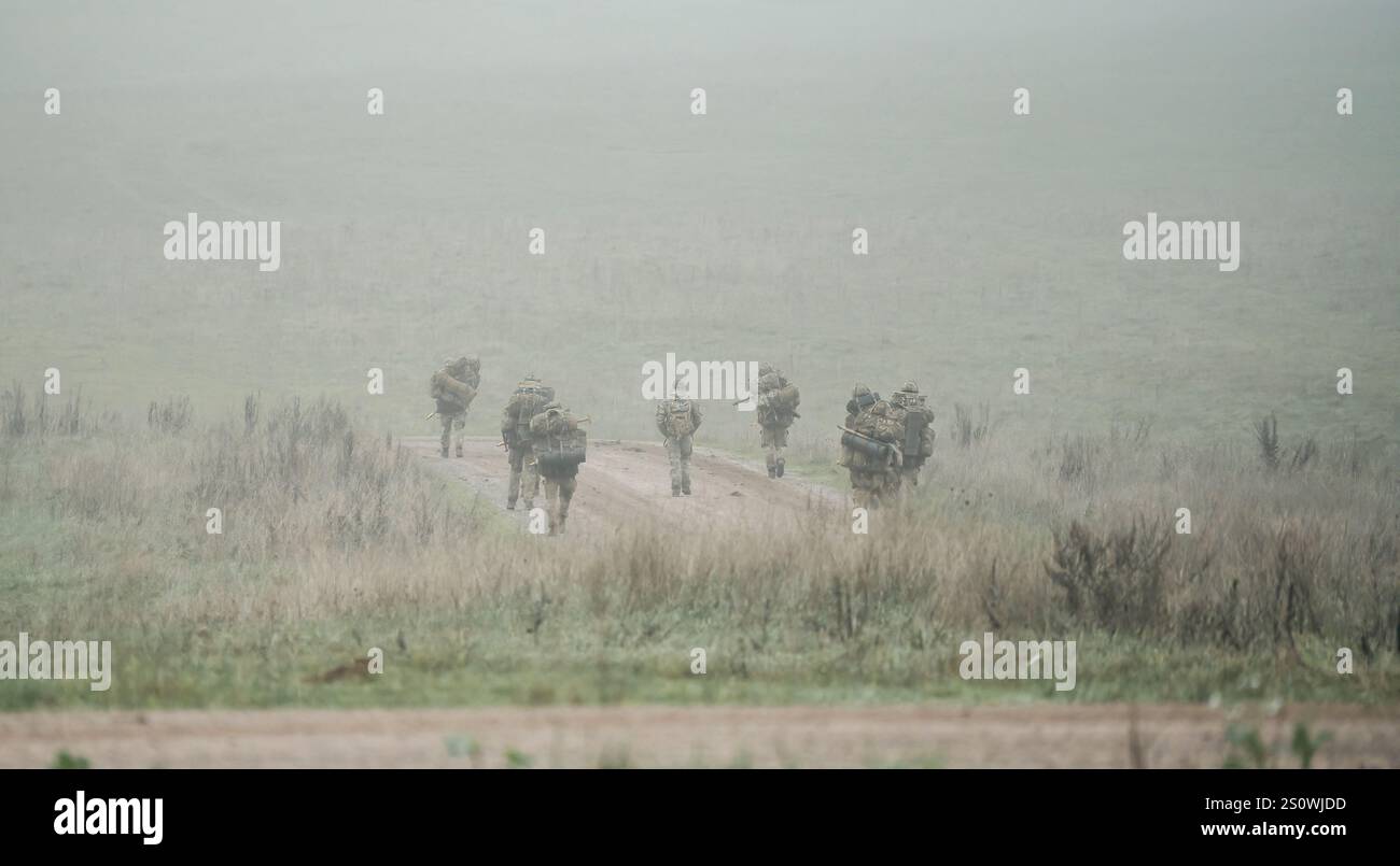 a unit of British army soldiers on a 40kg loaded march tab military ...