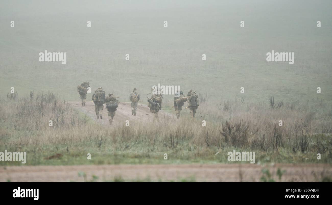 a unit of British army soldiers on a 40kg loaded march tab military ...