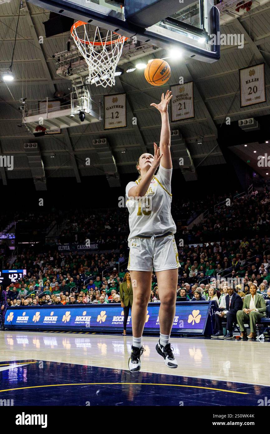 South Bend, Indiana, USA. 29th Dec, 2024. Notre Dame forward Kate Koval (13) goes up for a shot ...