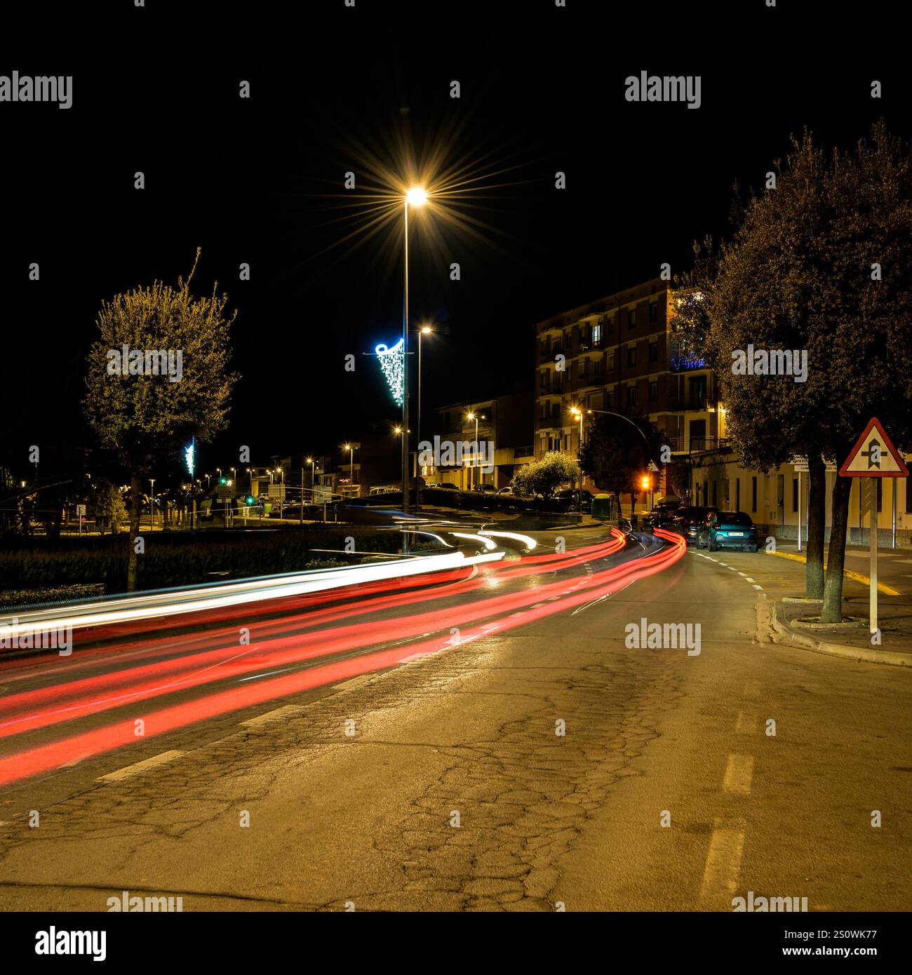 Carretera de Prats road, at night, in Avinyó, with cars passing and ...