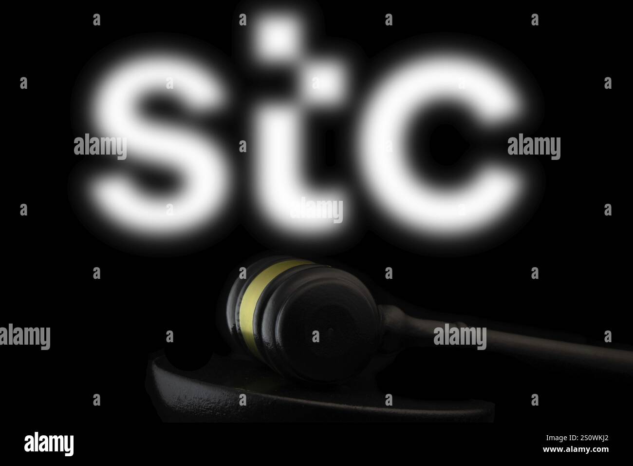 Court gavel in front of the STC logo. Saudi Telecom Company is a saudi ...