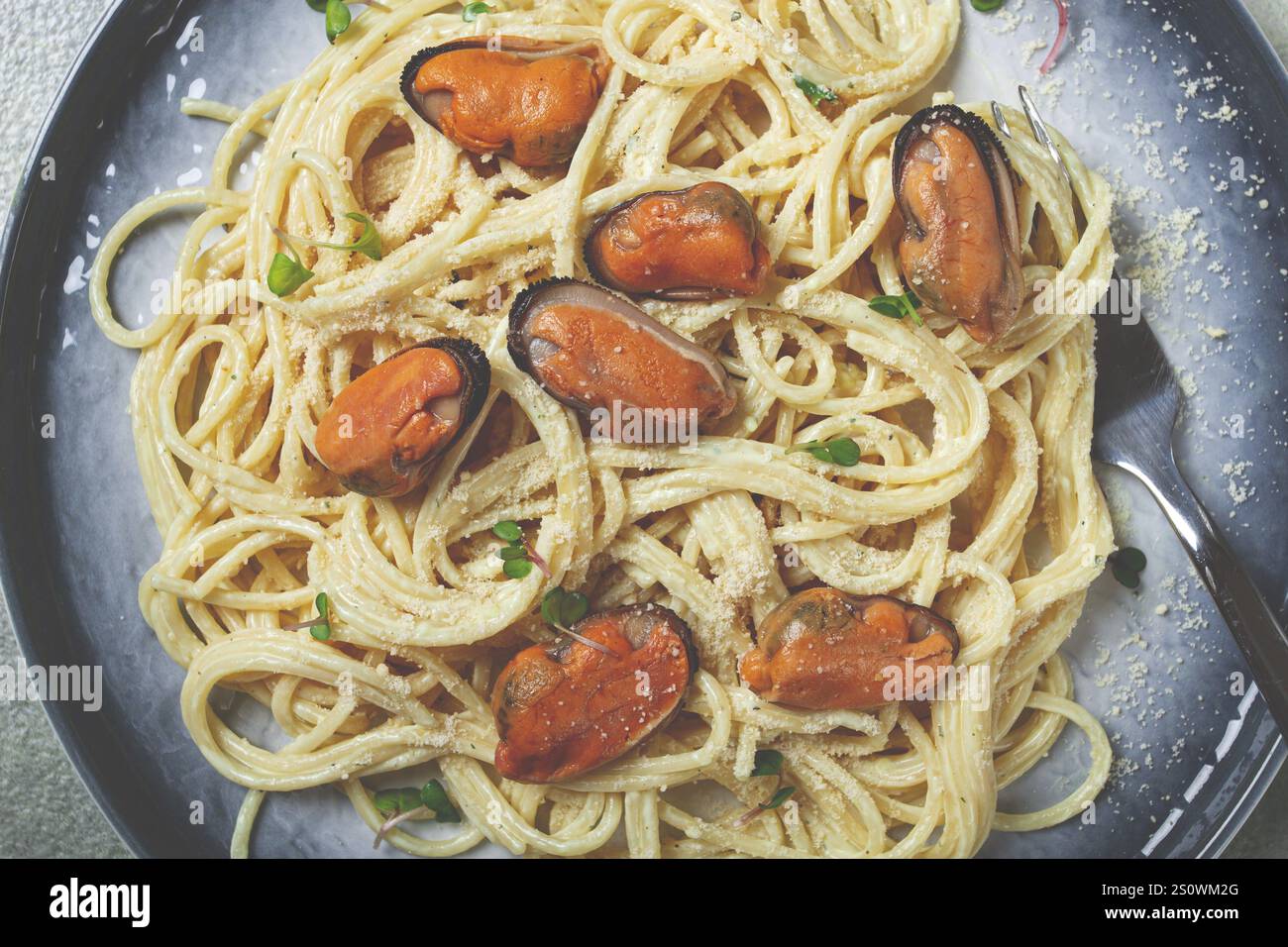 Spaghetti with mussels, without shell, pasta with peeled mussels, in ...