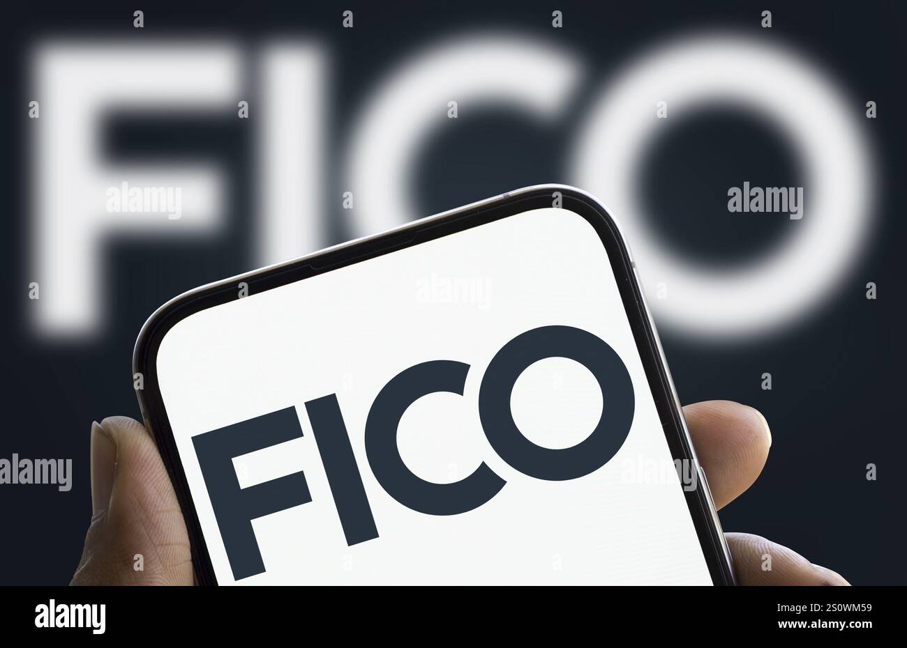 FICO logo is displayed on smartphone. FICO is an American data analytics company Stock Photo - Alamy