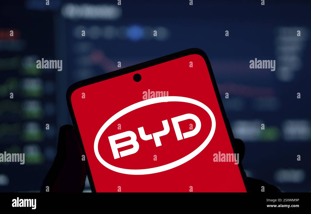 BYD logo is displayed on smartphone. BYD Auto Co Ltd is the main ...