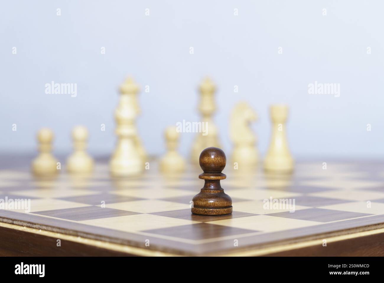 Chess pawn piece in the foreground during a game with a white ...
