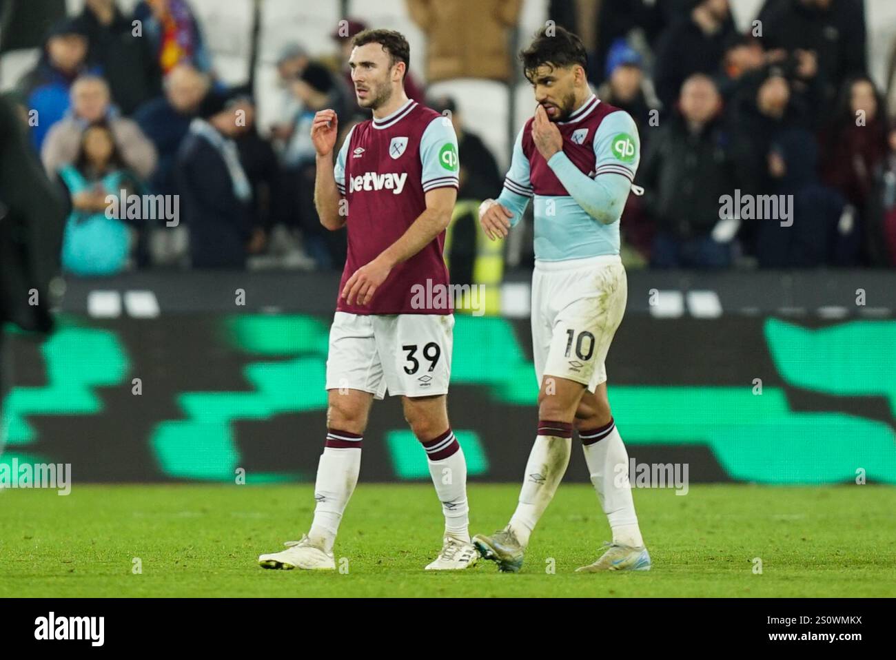 London, UK. 29th Dec, 2024. Andy Irving of West Ham United and Lucas ...