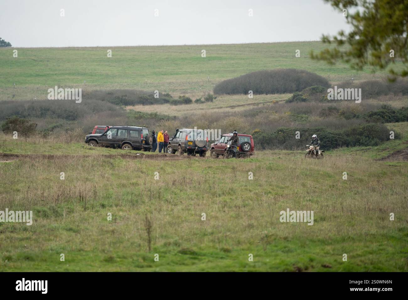 a group of 4x4 land rover discovery series II preparing to off-road ...