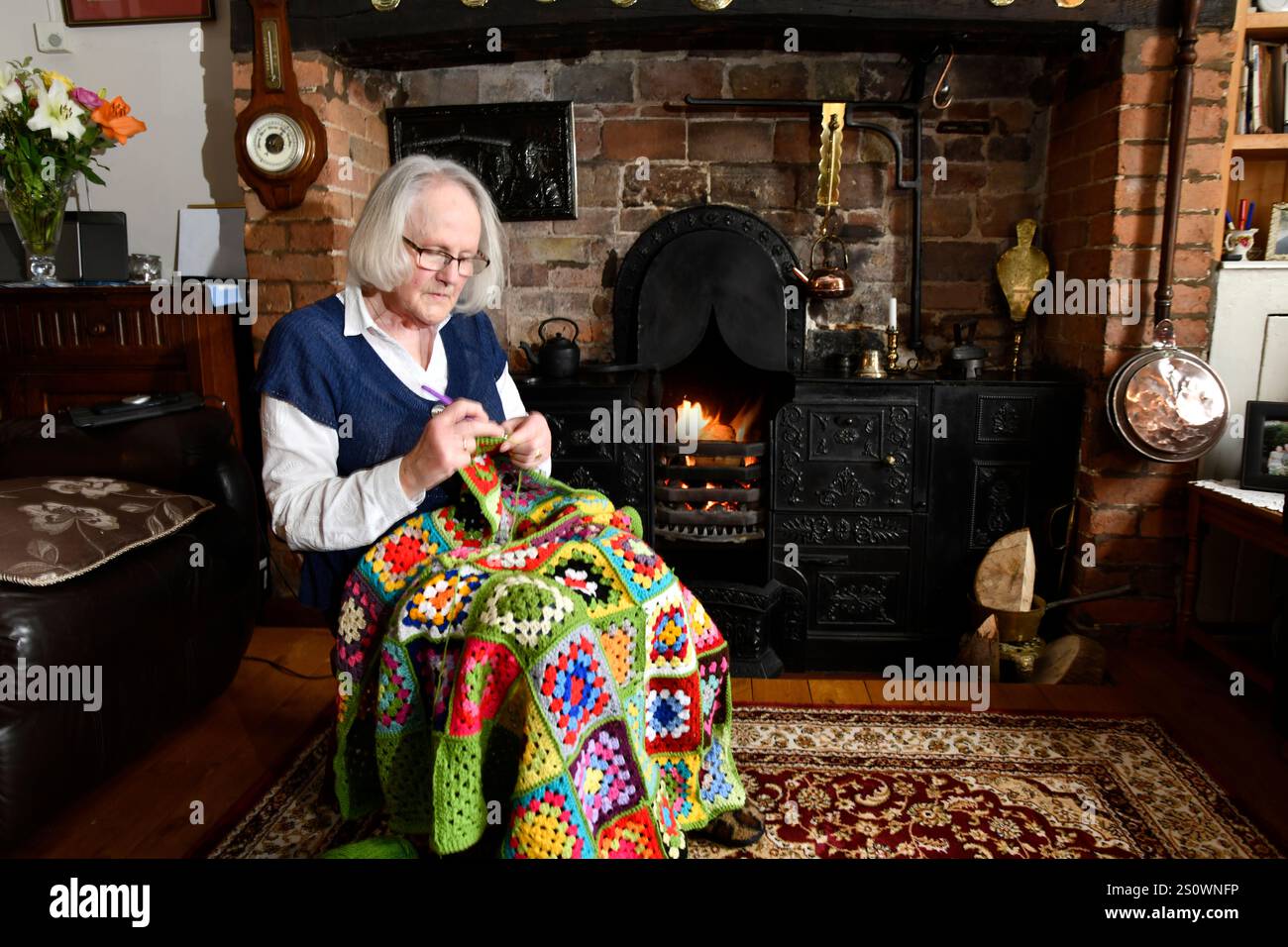 Lady crocheting in front of her families Coalbrookdale cast iron ...