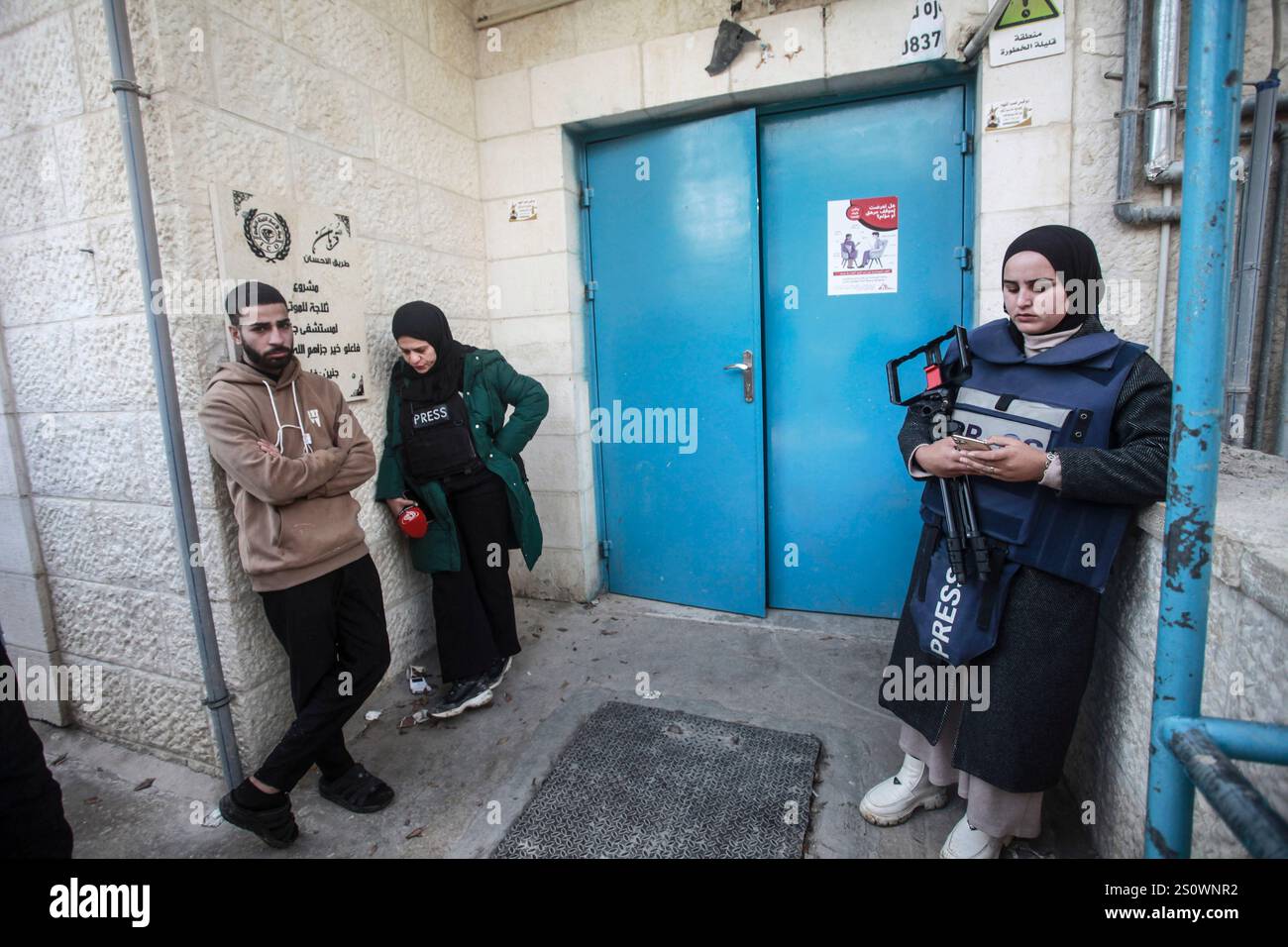 Jenin, Palestine. 29th Dec, 2024. Palestinian journalists wait for the ...