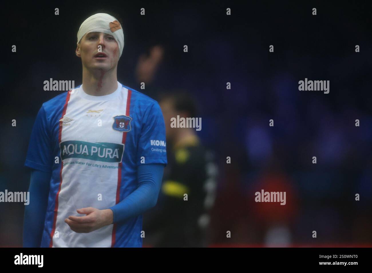 Carlisle United's Jon Mellish with a bandaged head during the Sky Bet ...