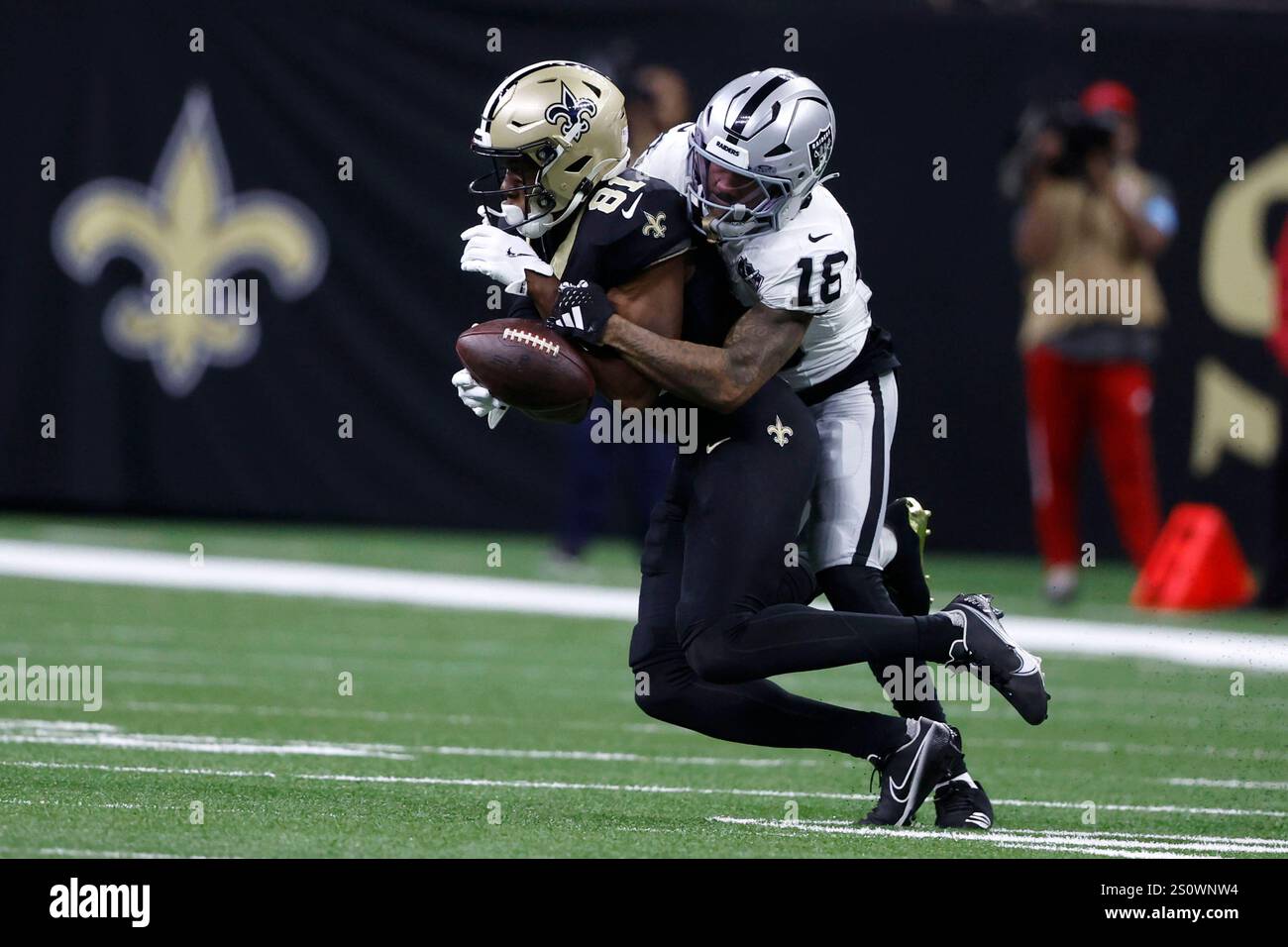 Las Vegas Raiders cornerback Jack Jones (18) breaks up a pass intended ...