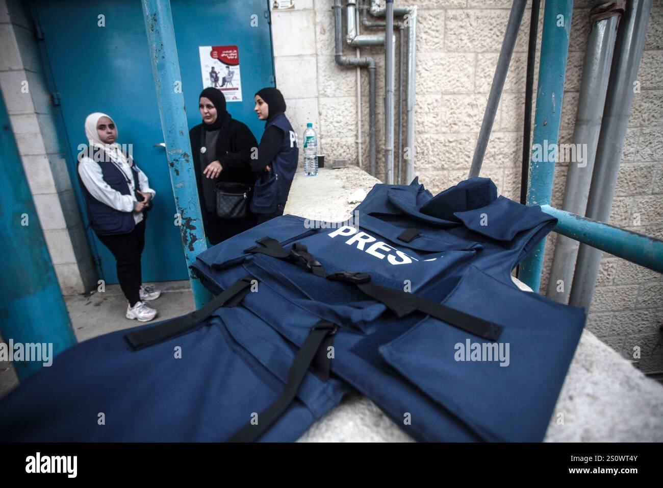 Jenin, Palestine. 29th Dec, 2024. Palestinian journalists wait for the ...