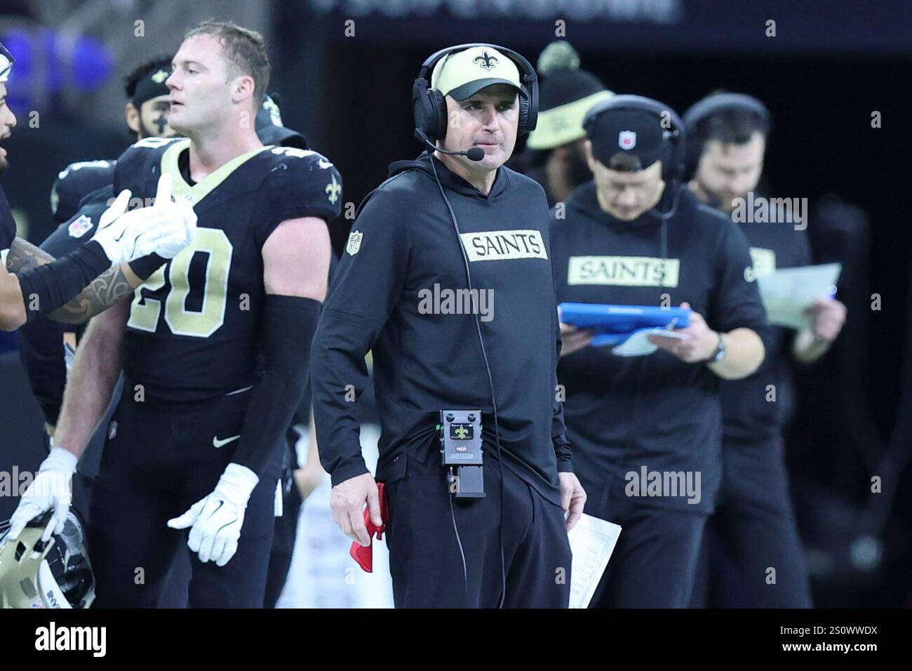 New Orleans Saints head coach Darren Rizzi watches the action from the ...