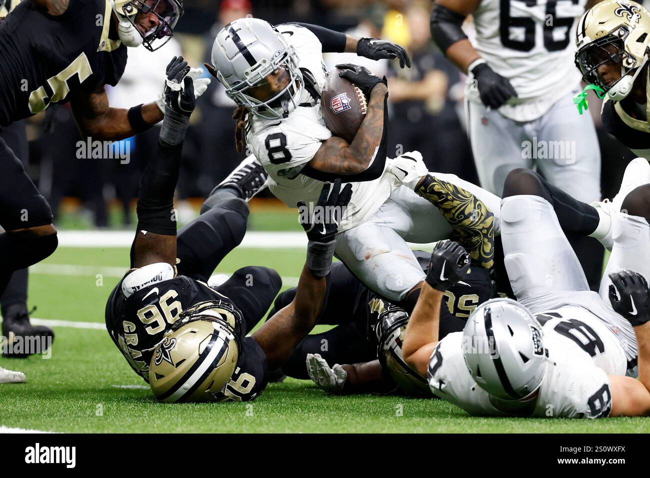 Las Vegas Raiders running back Ameer Abdullah (8) is tackled by New Orleans Saints defensive end ...