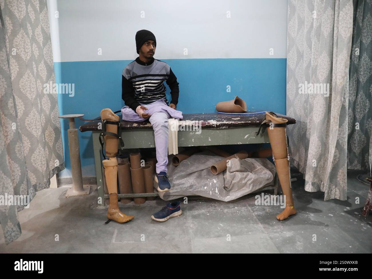 Kolkata, West Bengal, INDIA. 29th Dec, 2024. An amputee waits for his ...
