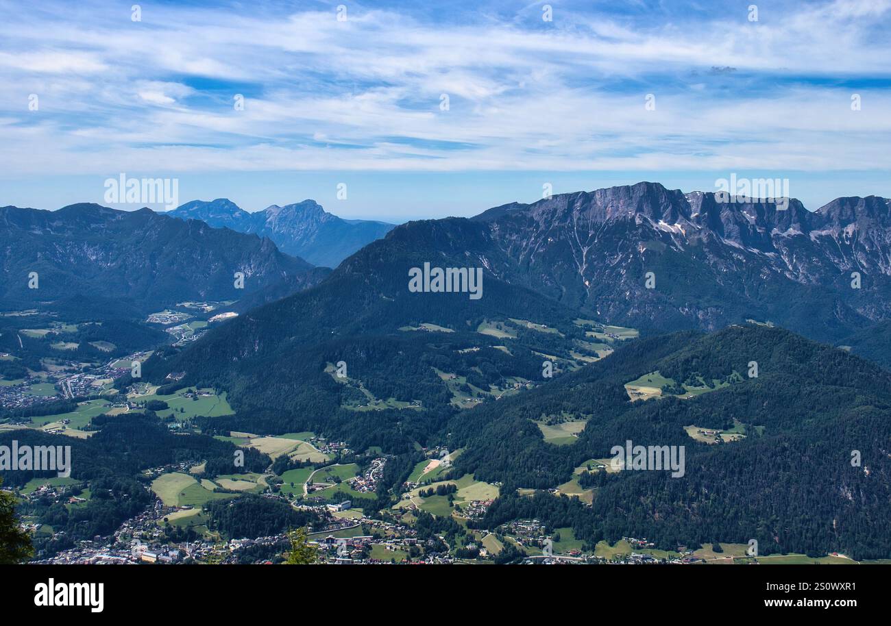 Aerial view of villages below mountains in the Bavarian Alps on a ...