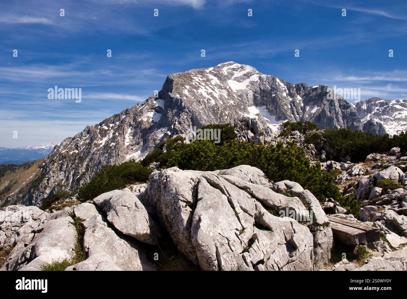 Mountain top with rocks and snow on a spring day in the Bavarian Alps ...