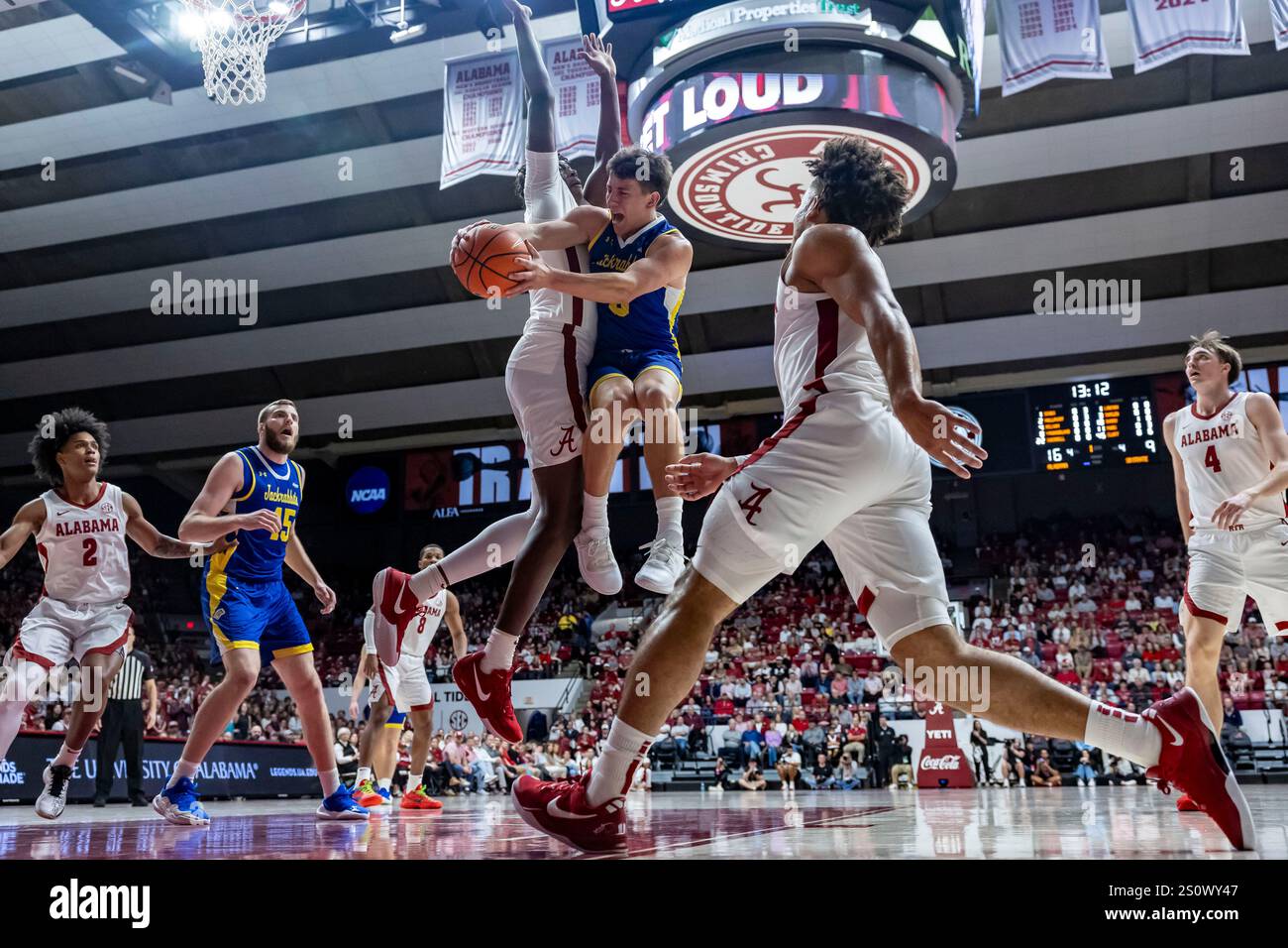 South Dakota State guard Joe Sayler (3), center top, looks to pass the ...