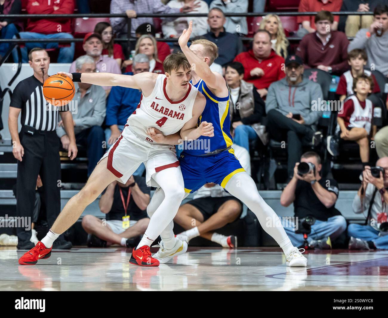 Alabama forward Grant Nelson (4) battles South Dakota State forward ...