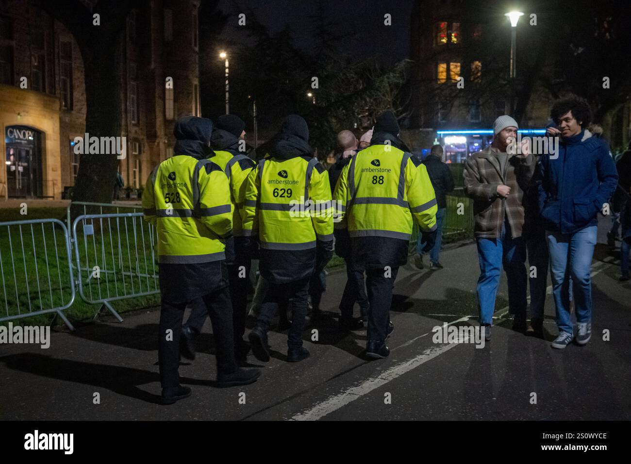Security head into the crowd to inform them of the events cancellation ...