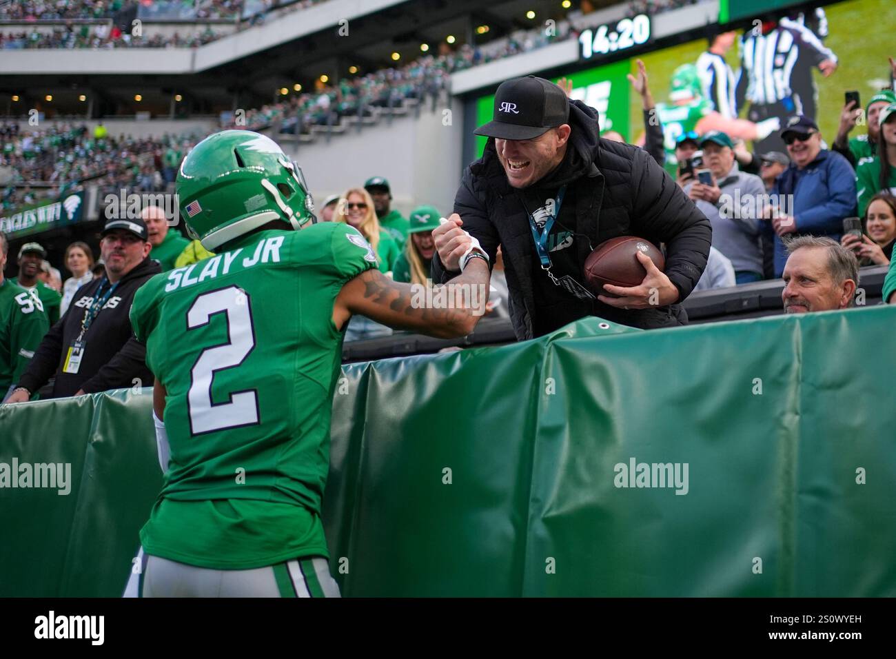 Philadelphia Eagles cornerback Darius Slay Jr. (2) gifts the football ...