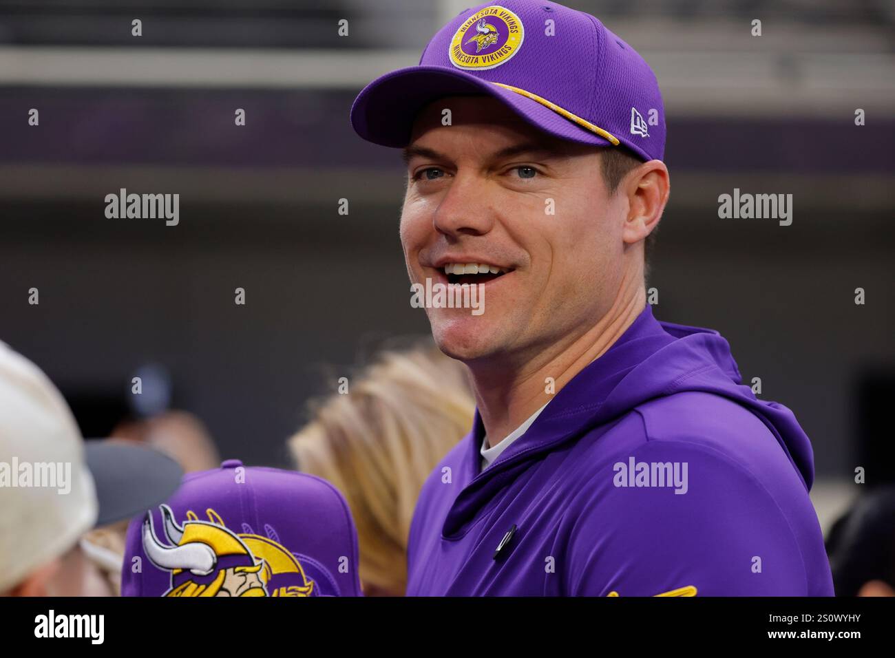 Minnesota Vikings head coach Kevin O'Connell smiles before an NFL football game against the ...