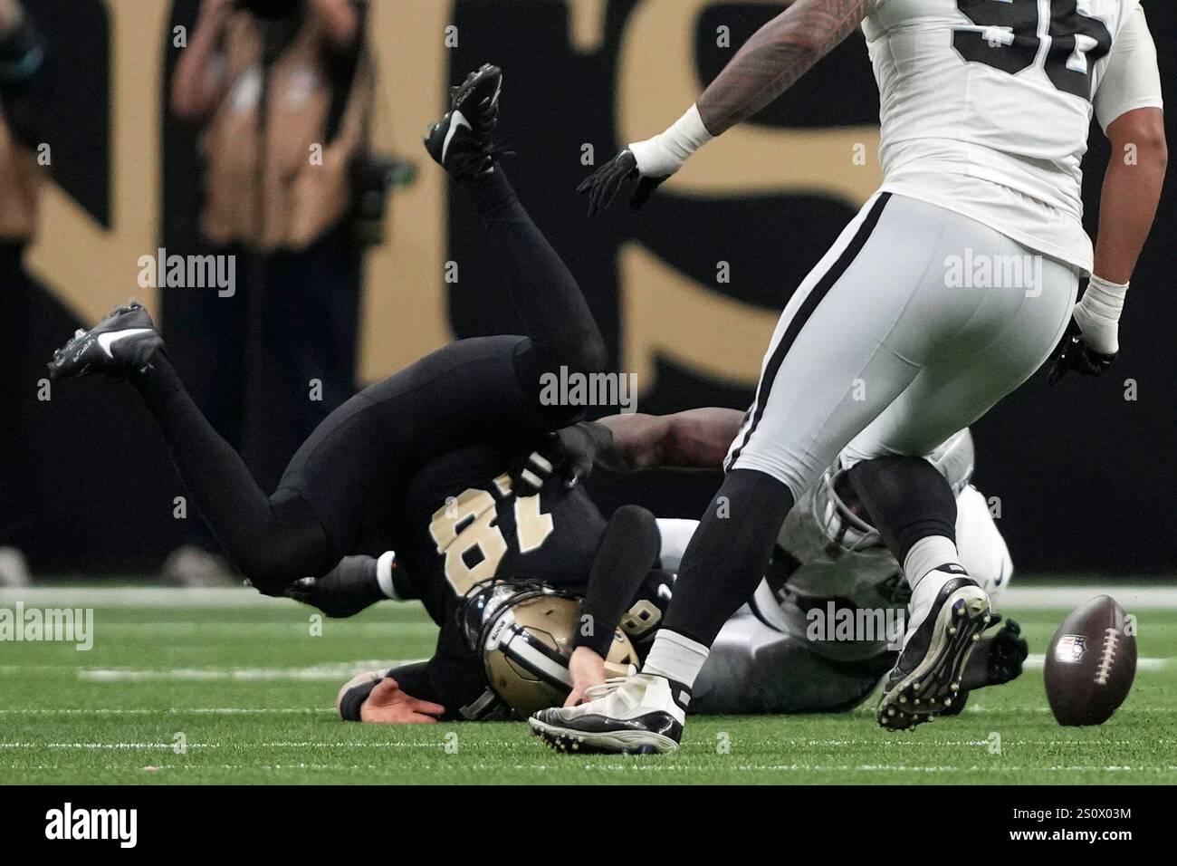 New Orleans Saints quarterback Spencer Rattler (18) is upended after ...