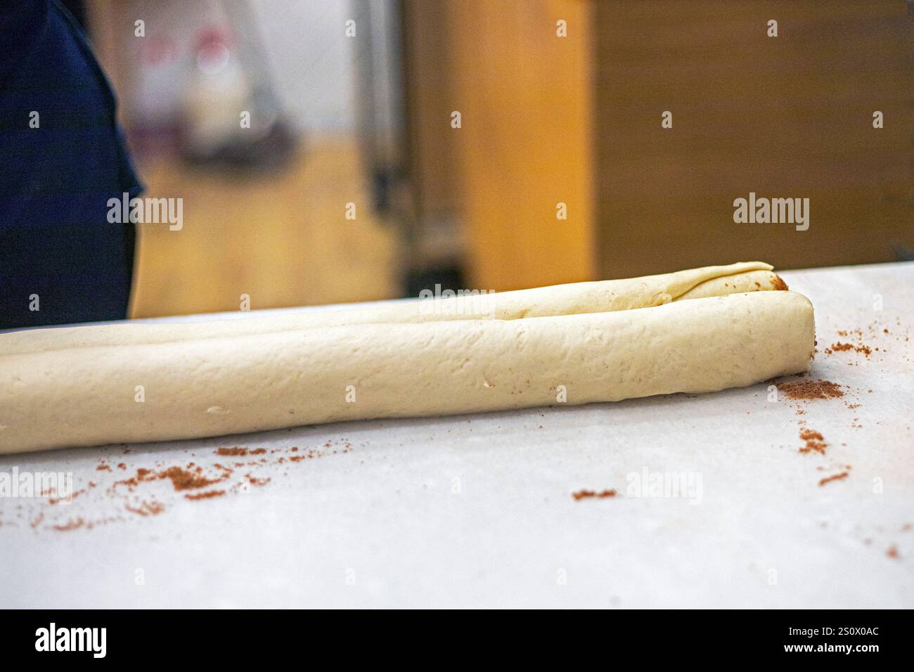 cooking cinnamon rolls by twisting the dough. Home bakery Stock Photo ...