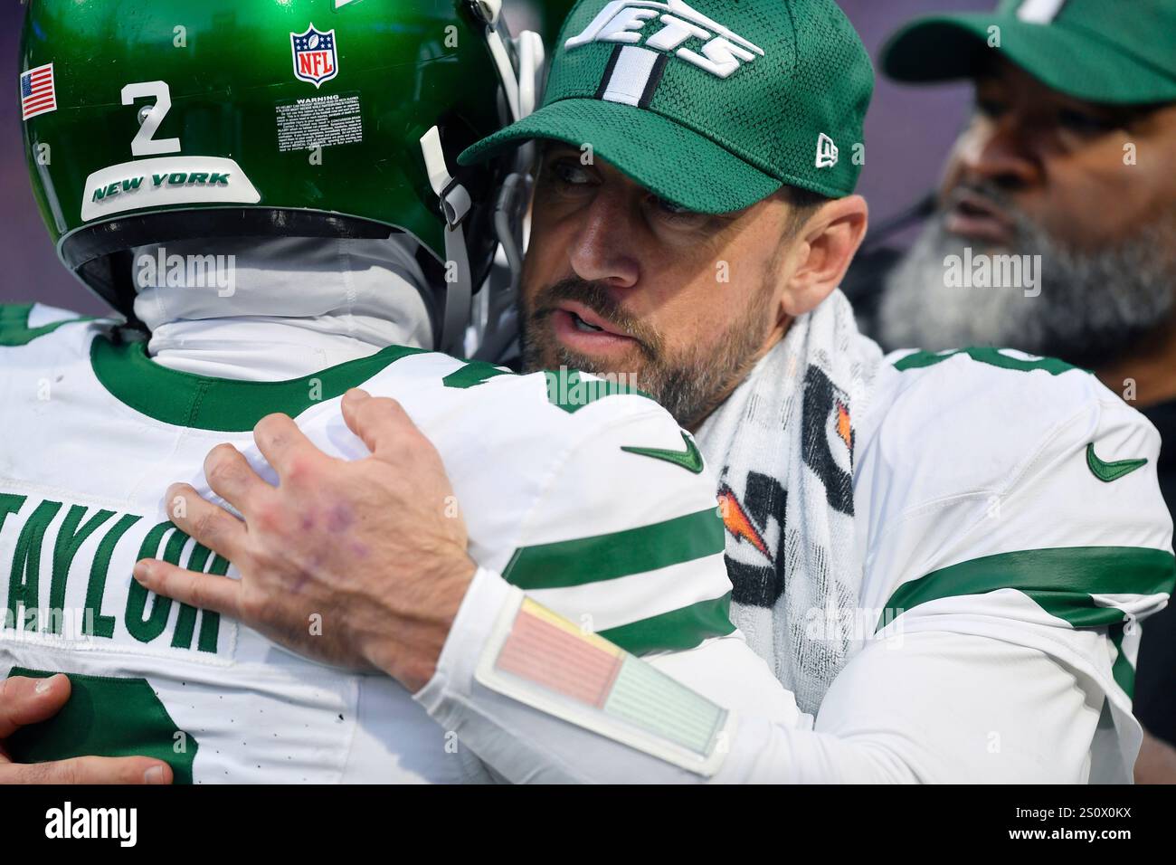 New York Jets quarterback Aaron Rodgers, left, hugs teammate ...