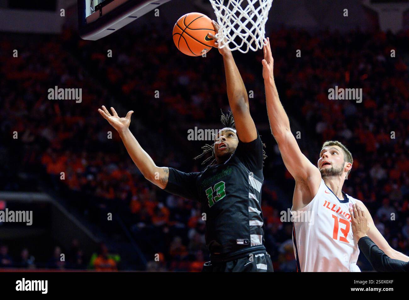 Chicago State's Jalen Forrest, left, grabs a rebound from Illinois ...