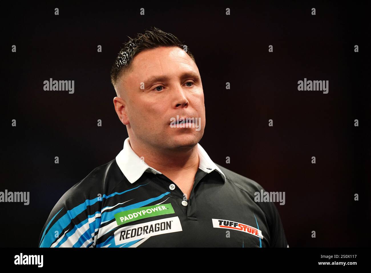 Gerwyn Price walks out to play his fourth round match against Jonny Clayton (not pictured) on ...