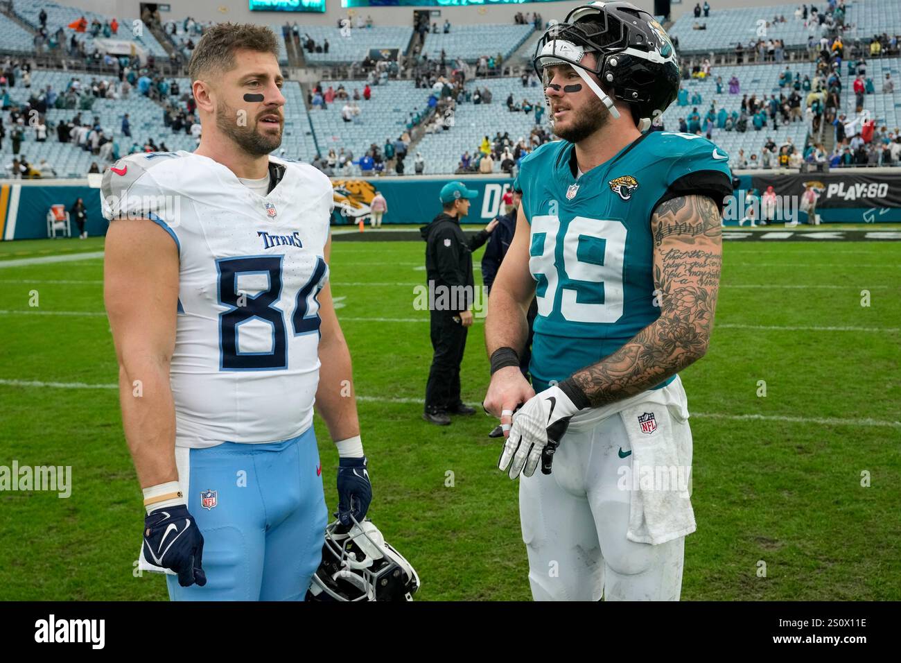 Tennessee Titans tight end Nick Vannett (84) talks with Jacksonville Jaguars tight end Luke ...