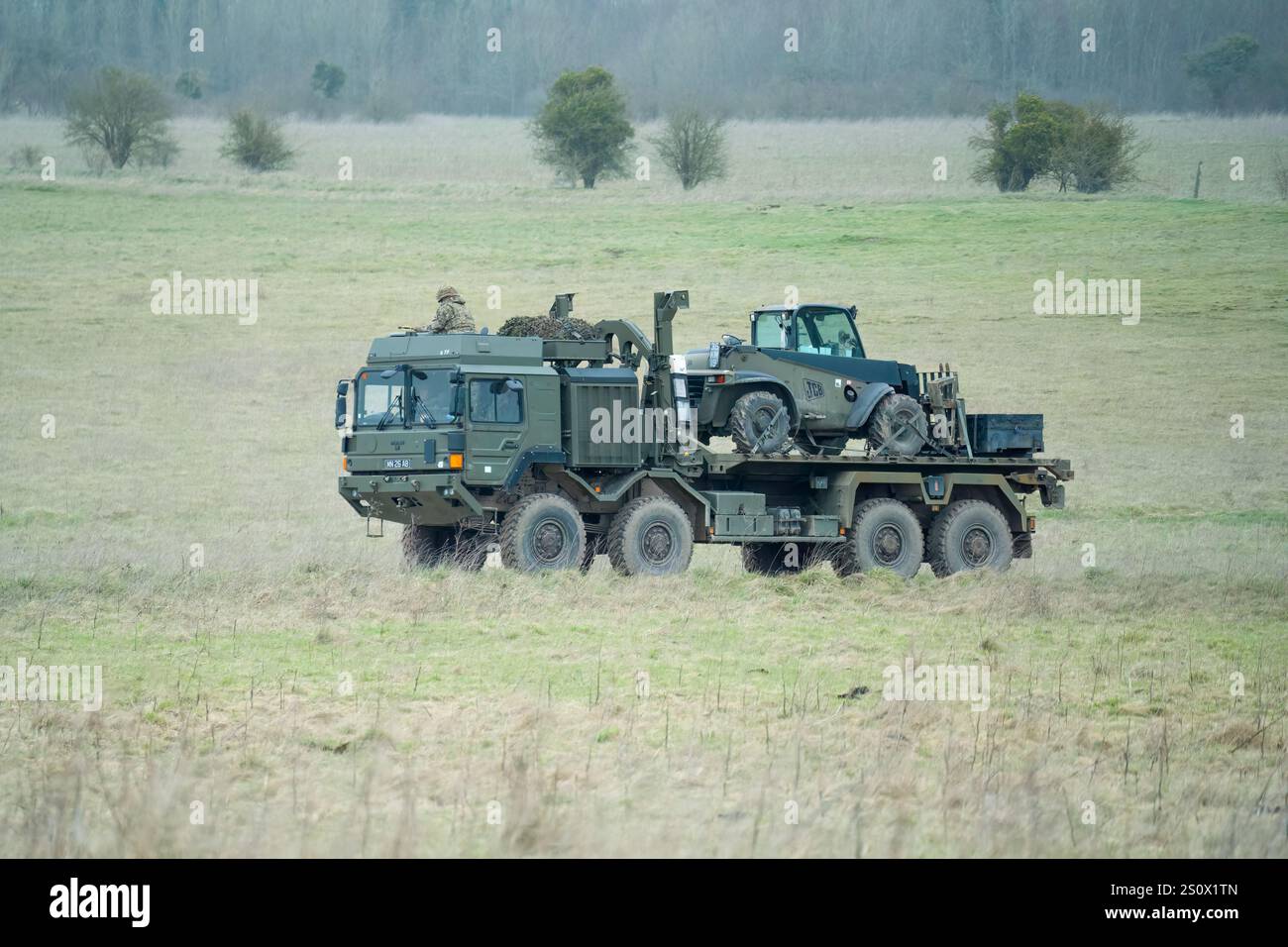 British army MAN SV 8x8 EPLS logistics truck carrying a JCB Fork Lift ...