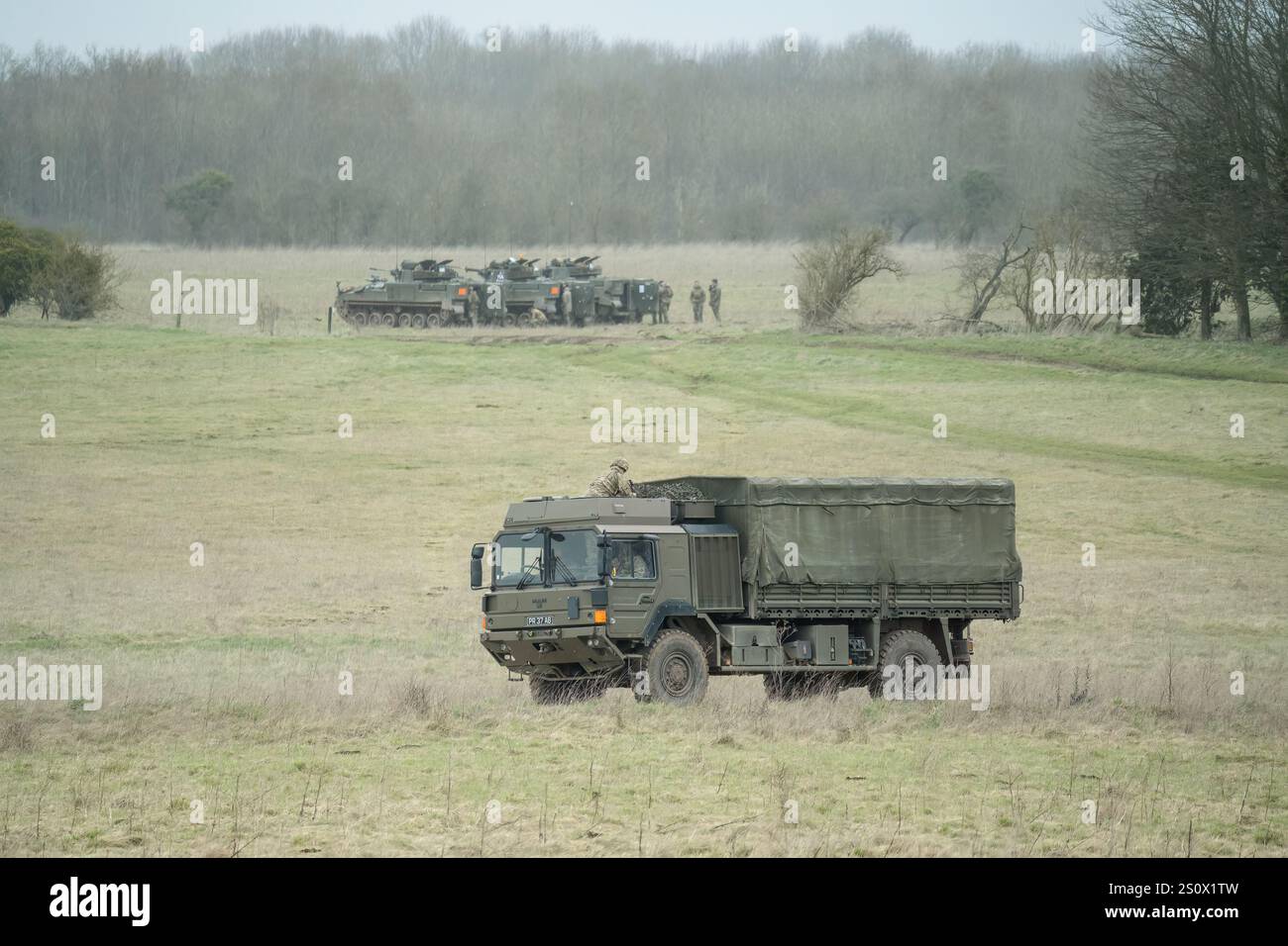 British army MAN SV 4x4 logistics truck, driving an unmade road, in ...