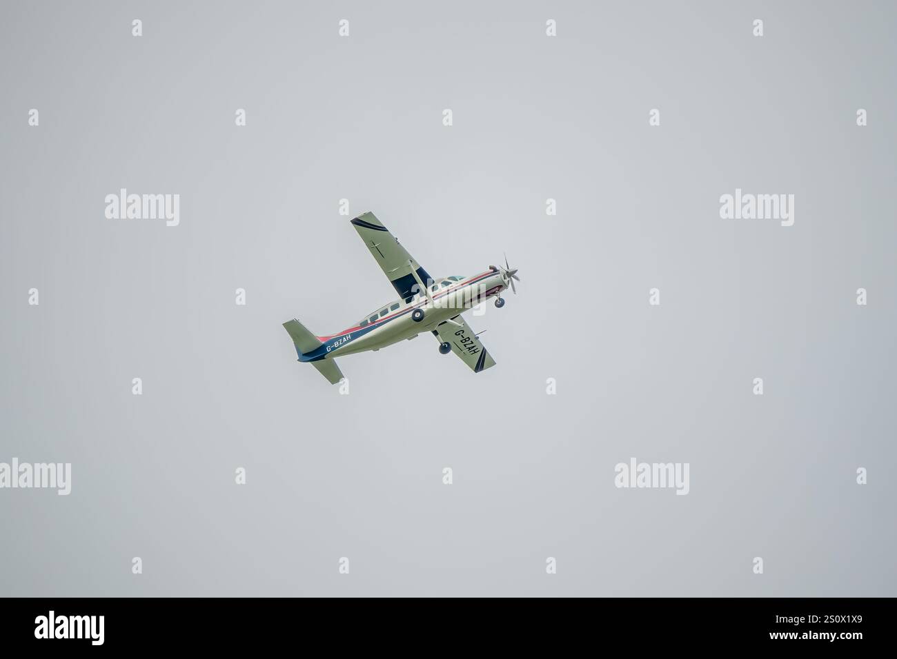 Cessna 208b Grand Caravan G-BZAH light aircraft ascending, on a flight ...
