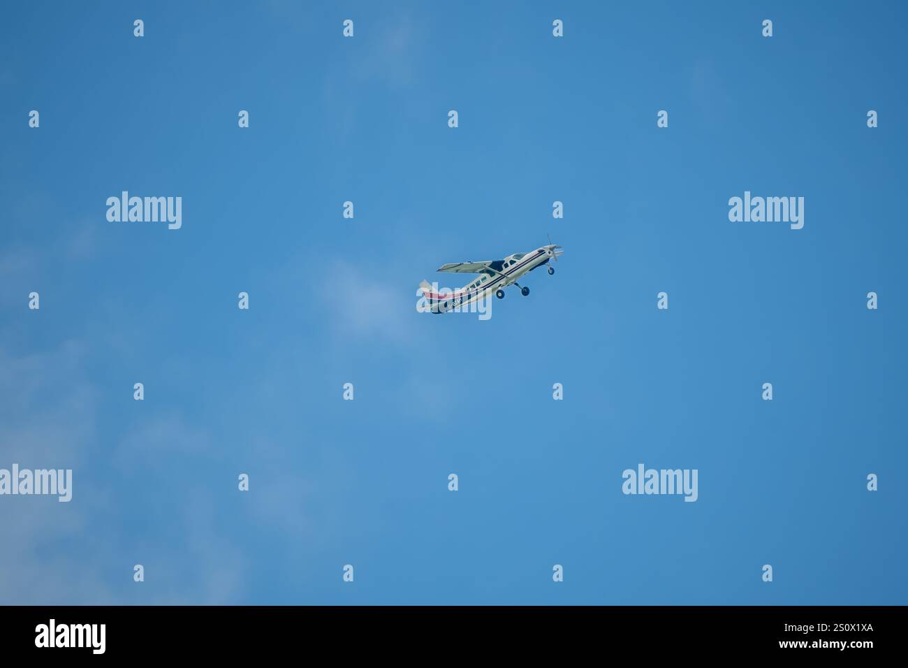 Cessna 208b Grand Caravan G-BZAH light aircraft ascending, on a flight ...